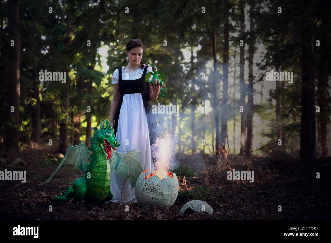 Woman with dragon baby, dragon next to the baby, fire spewing out of ...
