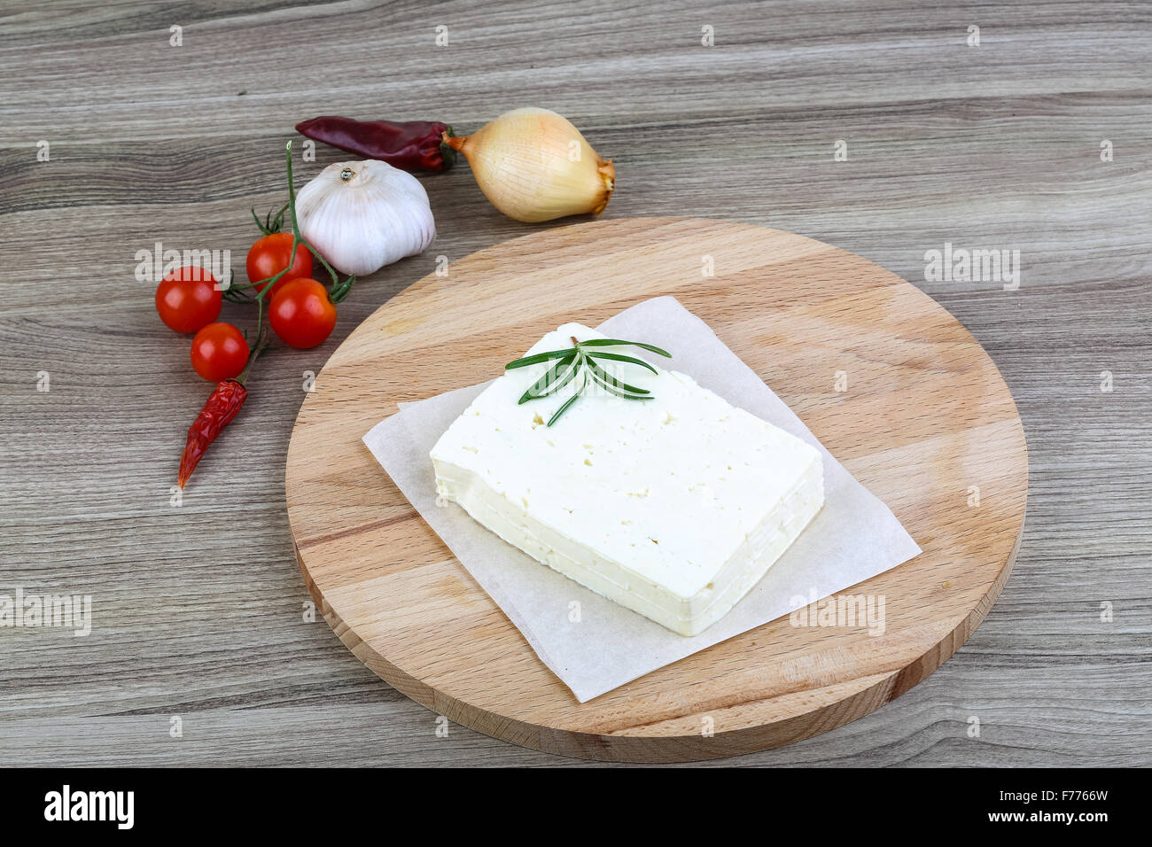 Traditional Caucasian homemade Cheese Brinza with rosemary on wood ...