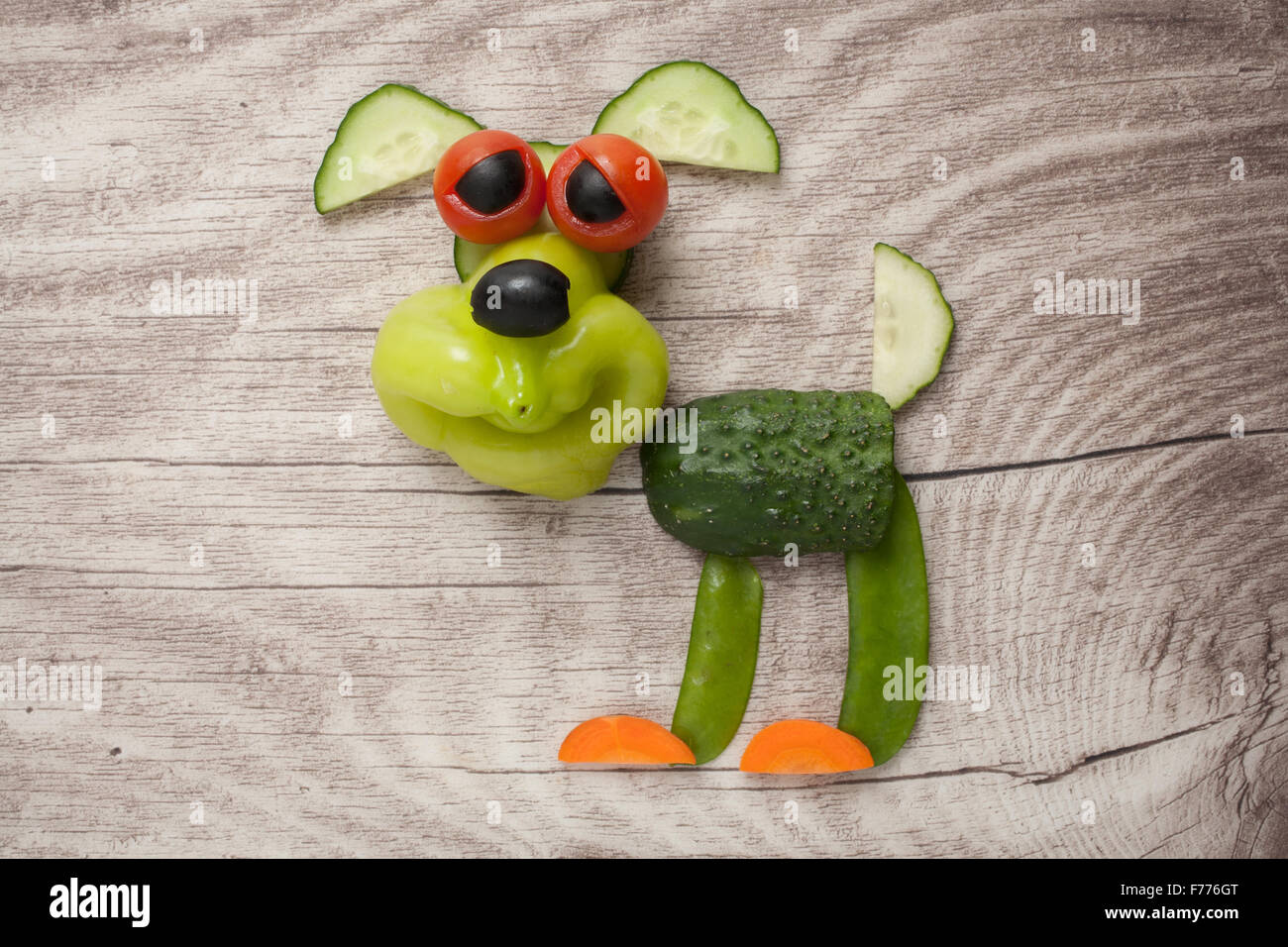 Funny dog made of vegetables on wooden bacground Stock Photo - Alamy