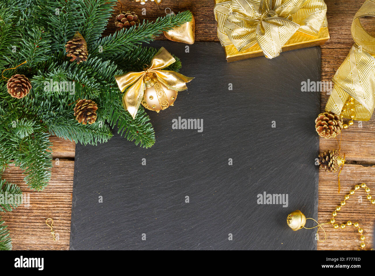 evergreen tree with golden decorations Stock Photo - Alamy