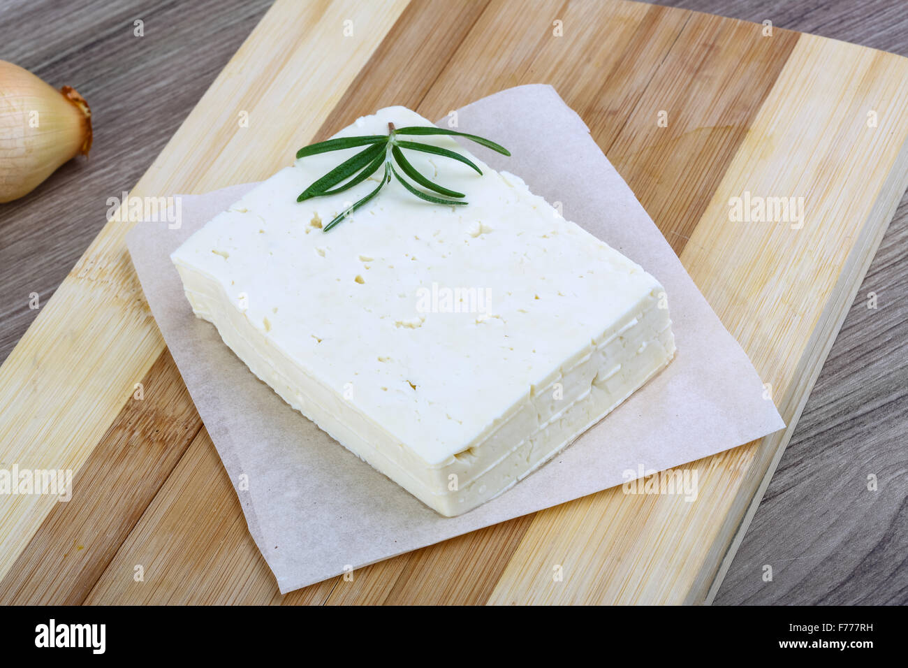 Traditional Caucasian homemade Cheese Brinza with rosemary on wood ...