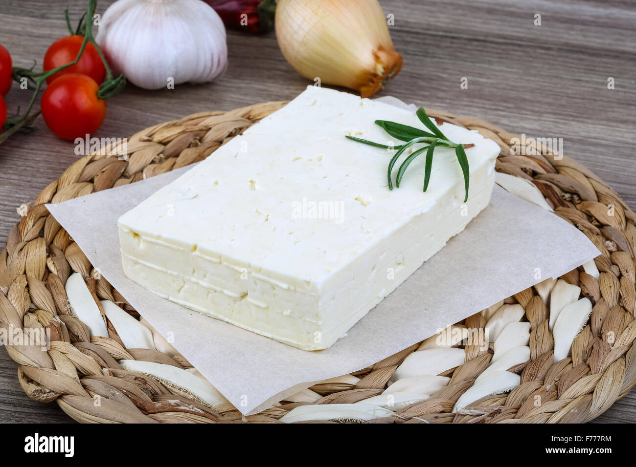 Traditional Caucasian homemade Cheese Brinza with rosemary on wood ...