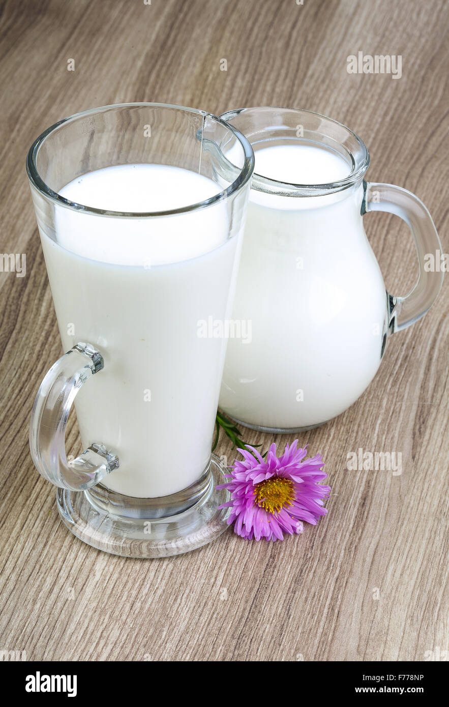 Fresh cold milk in glass on the wood background Stock Photo - Alamy