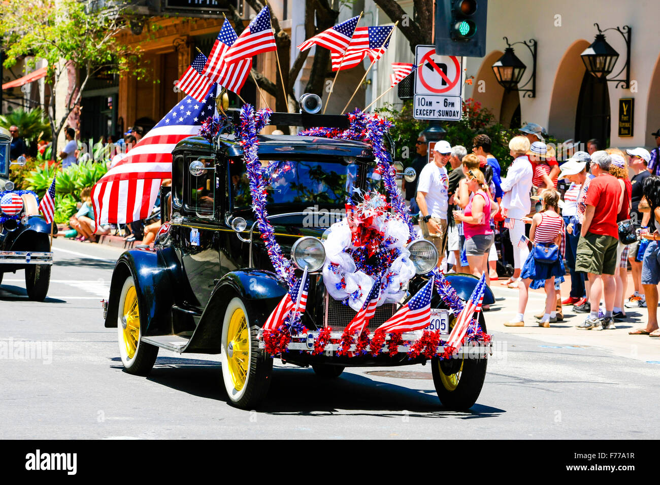 The vintage car group drive their cars along State street bedecked in ...