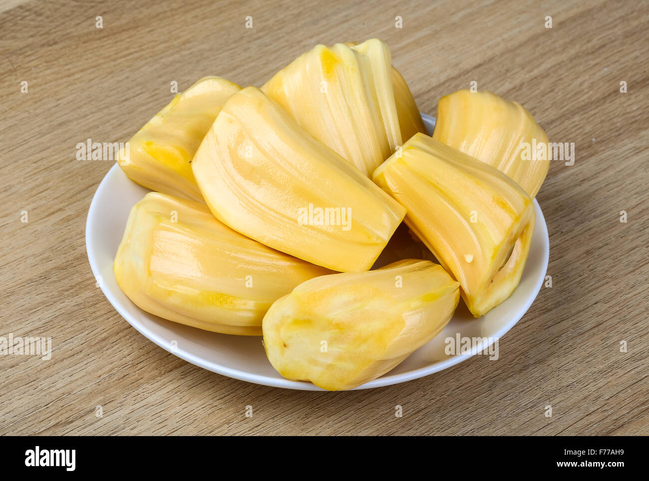 Tropical Jack Fruit on the wood background Stock Photo - Alamy