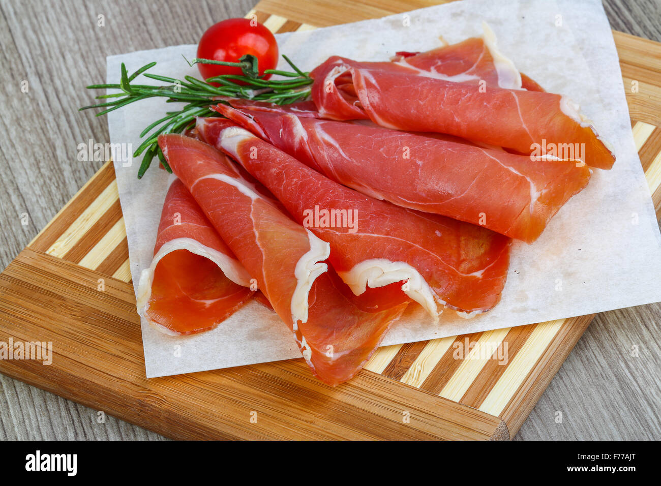 Spanish traditional snack - Jamon with tomato and rosemary Stock Photo ...