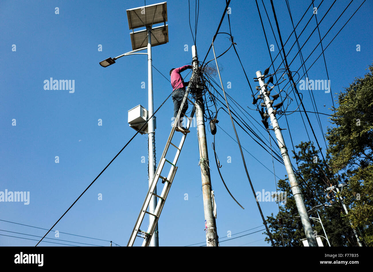 a cable technician at work in Kathmandu, 2015 Stock Photo - Alamy