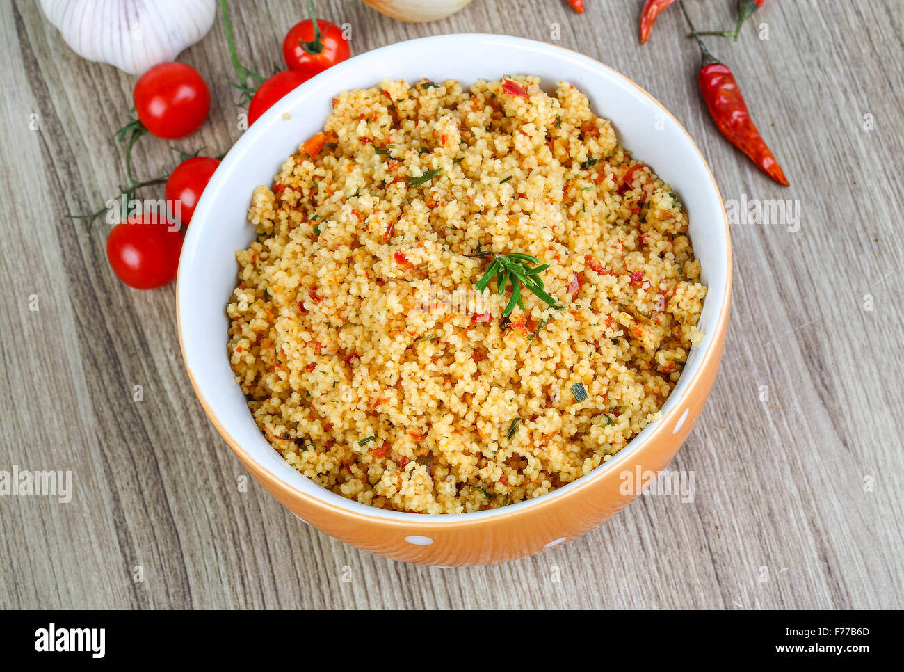 Arabic traditional cuisine - Couscous with tomato and green onion Stock ...
