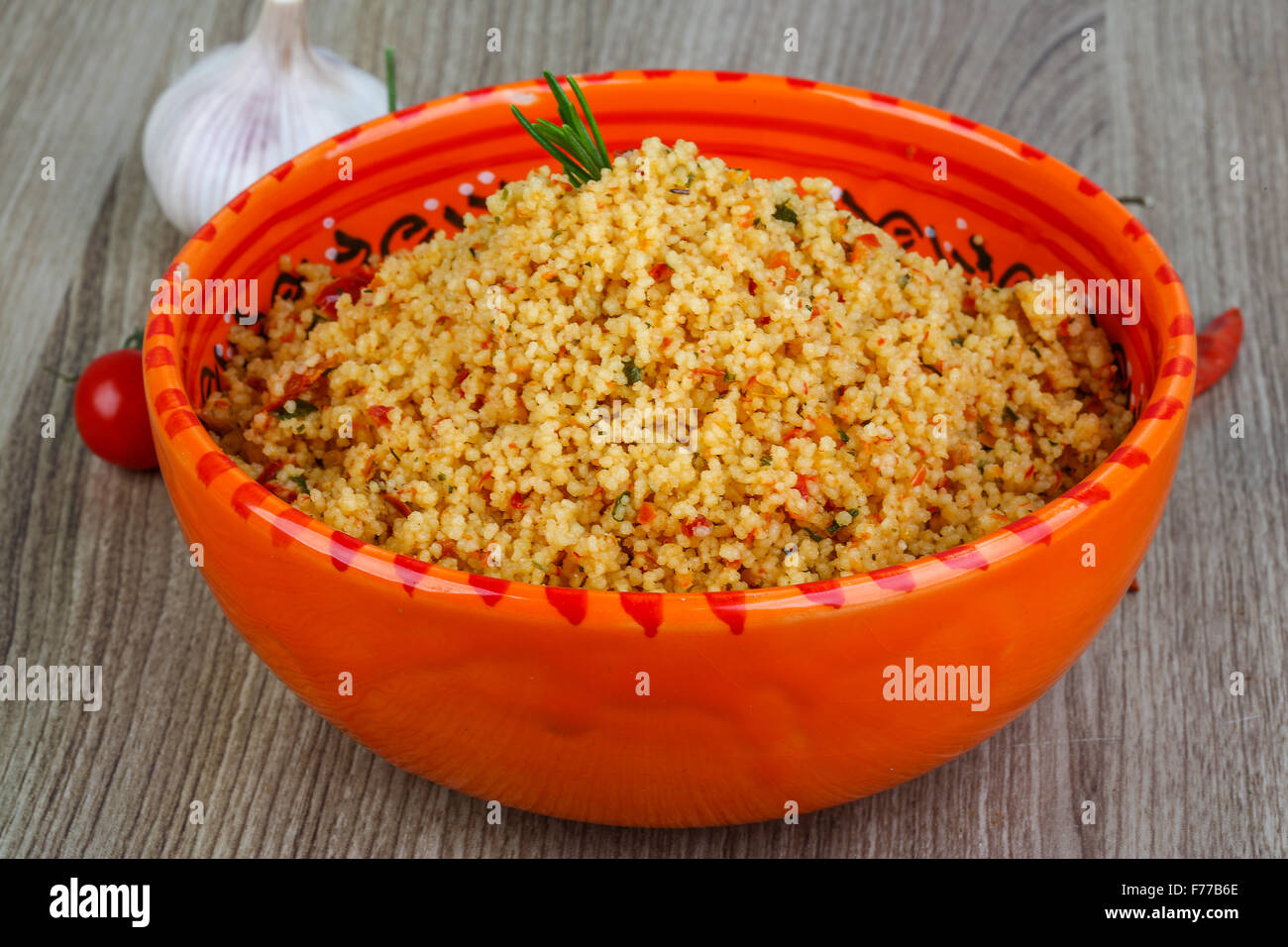 Arabic traditional cuisine - Couscous with tomato and green onion Stock ...