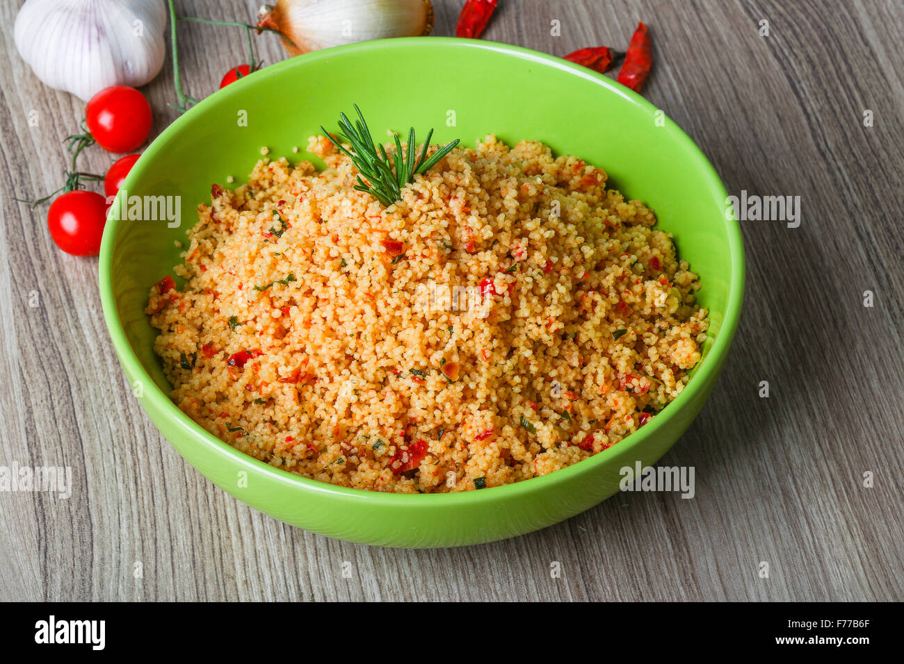 Arabic traditional cuisine - Couscous with tomato and green onion Stock ...