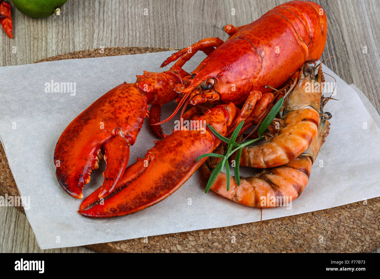 Big cooked lobster and tiger shrimps ready for eating Stock Photo - Alamy