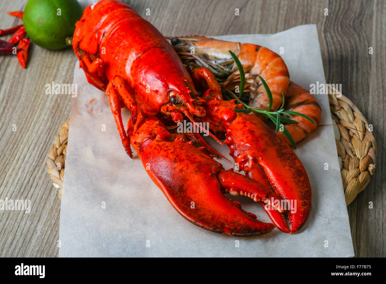 Big cooked lobster and tiger shrimps ready for eating Stock Photo - Alamy