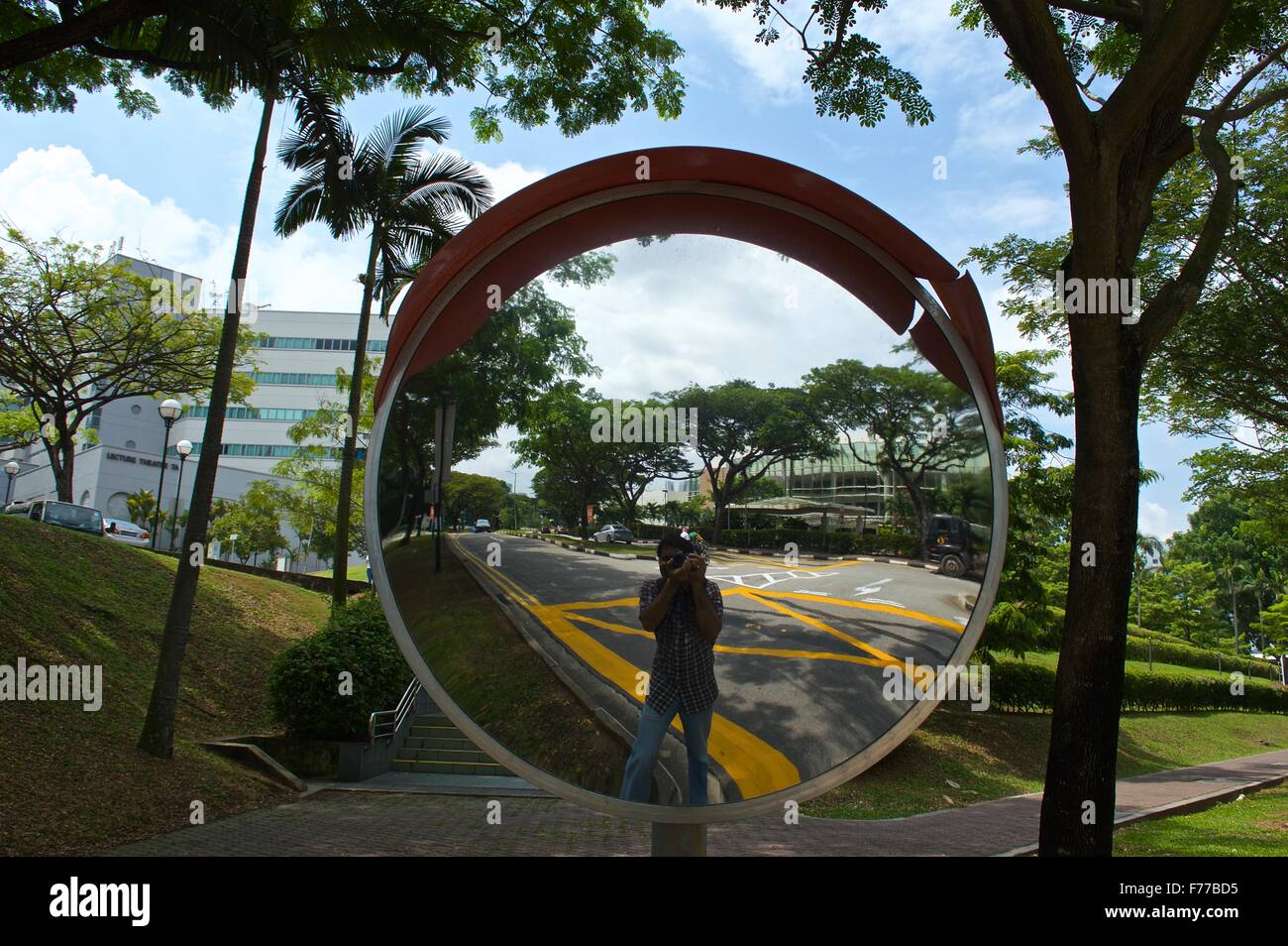 A concave mirror in accidental prone area of the road for traffic ...