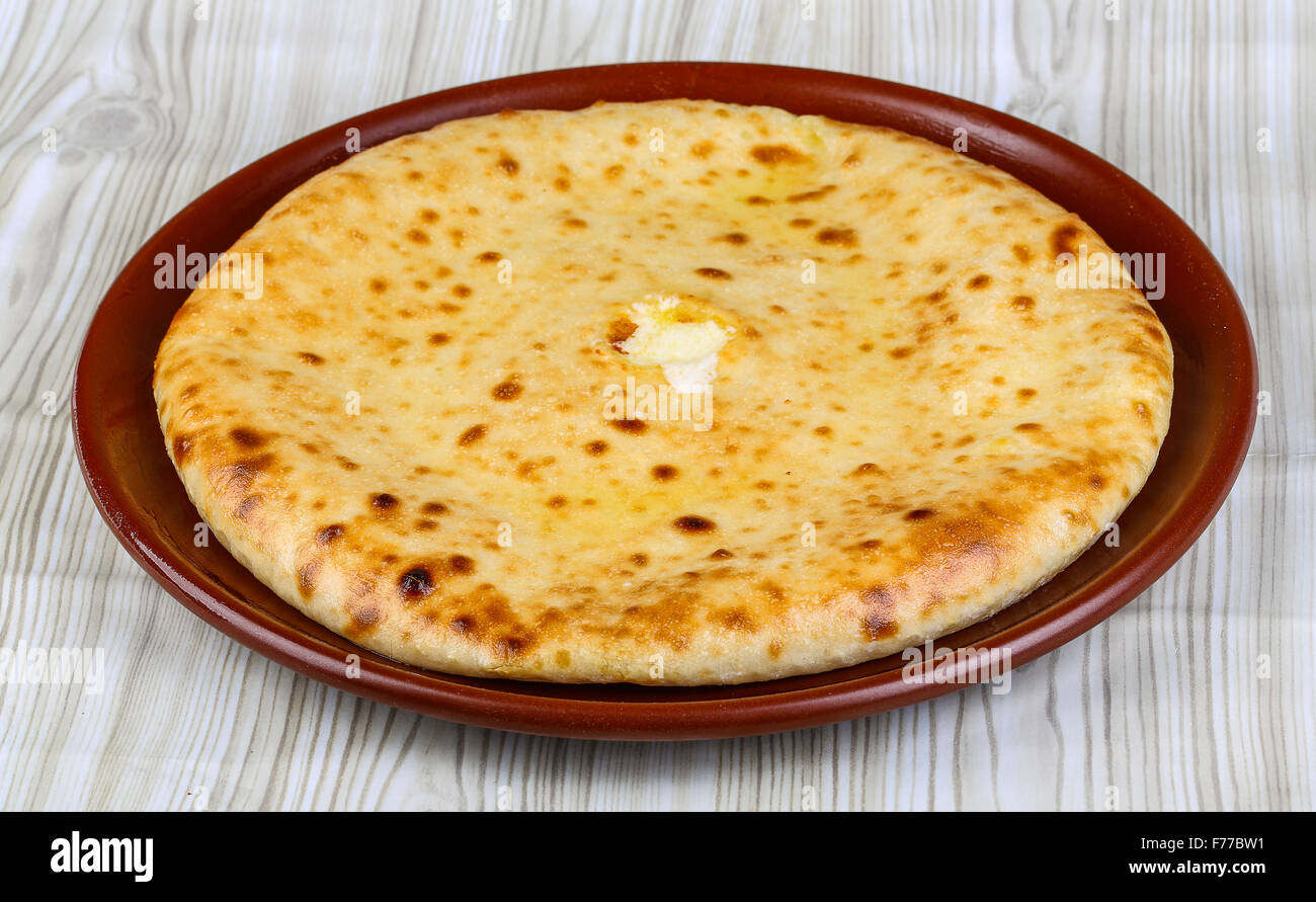 Oriental pastry - fresh hot Ossetian pie in the plate Stock Photo - Alamy