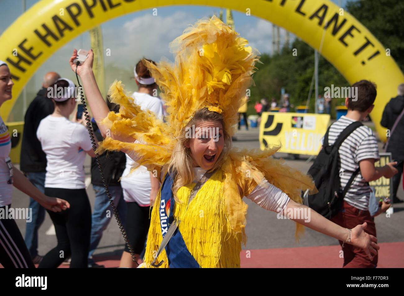 Girl in yellow at a paint station for the Color Run - The happiest 5K ...