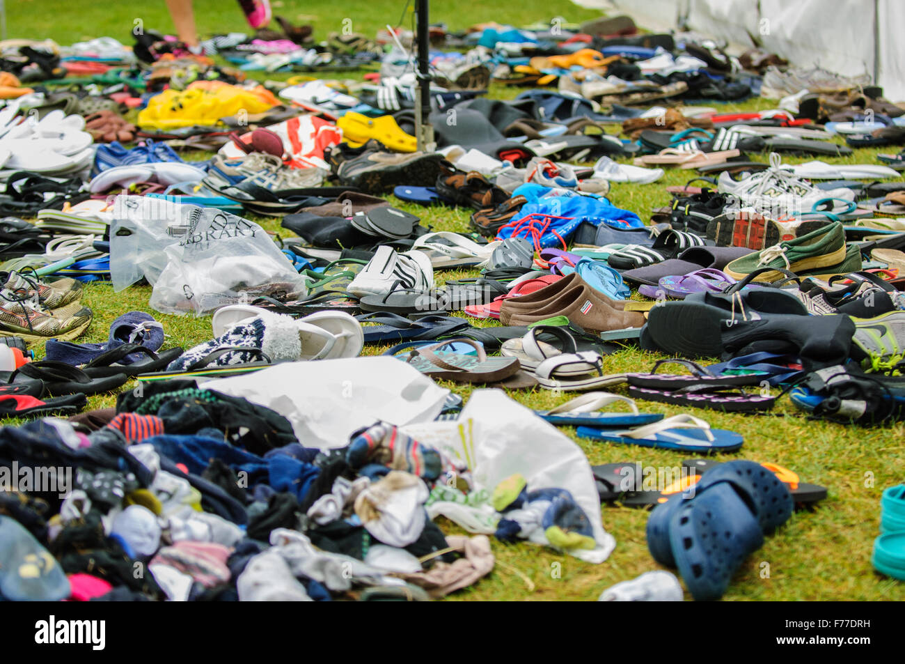 Collection of sports shoes left behind by triathletes competing in the ...
