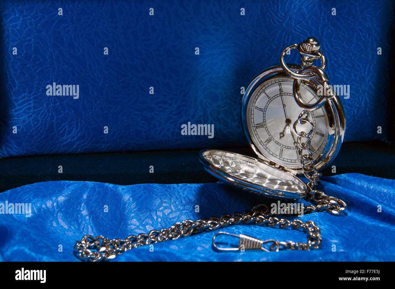 Vintage pocket watch and hour glass or sand timer, symbols of time with ...