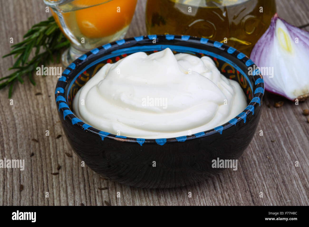 Mayonnaise sauce served raw egg, olive oil and rosemary Stock Photo - Alamy