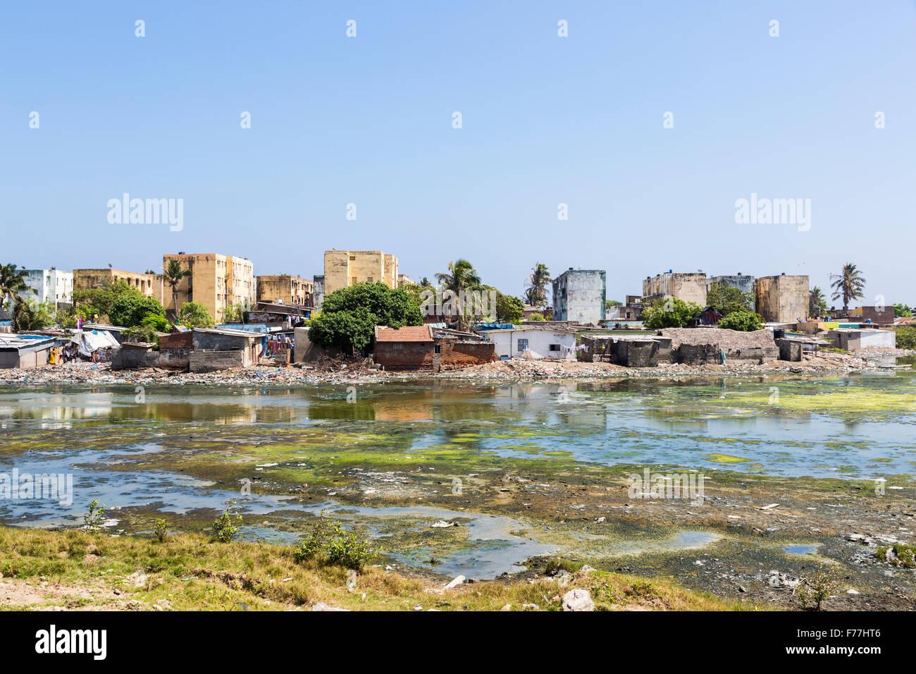 Third world poverty lifestyle: Apartment blocks, riverside shacks ...