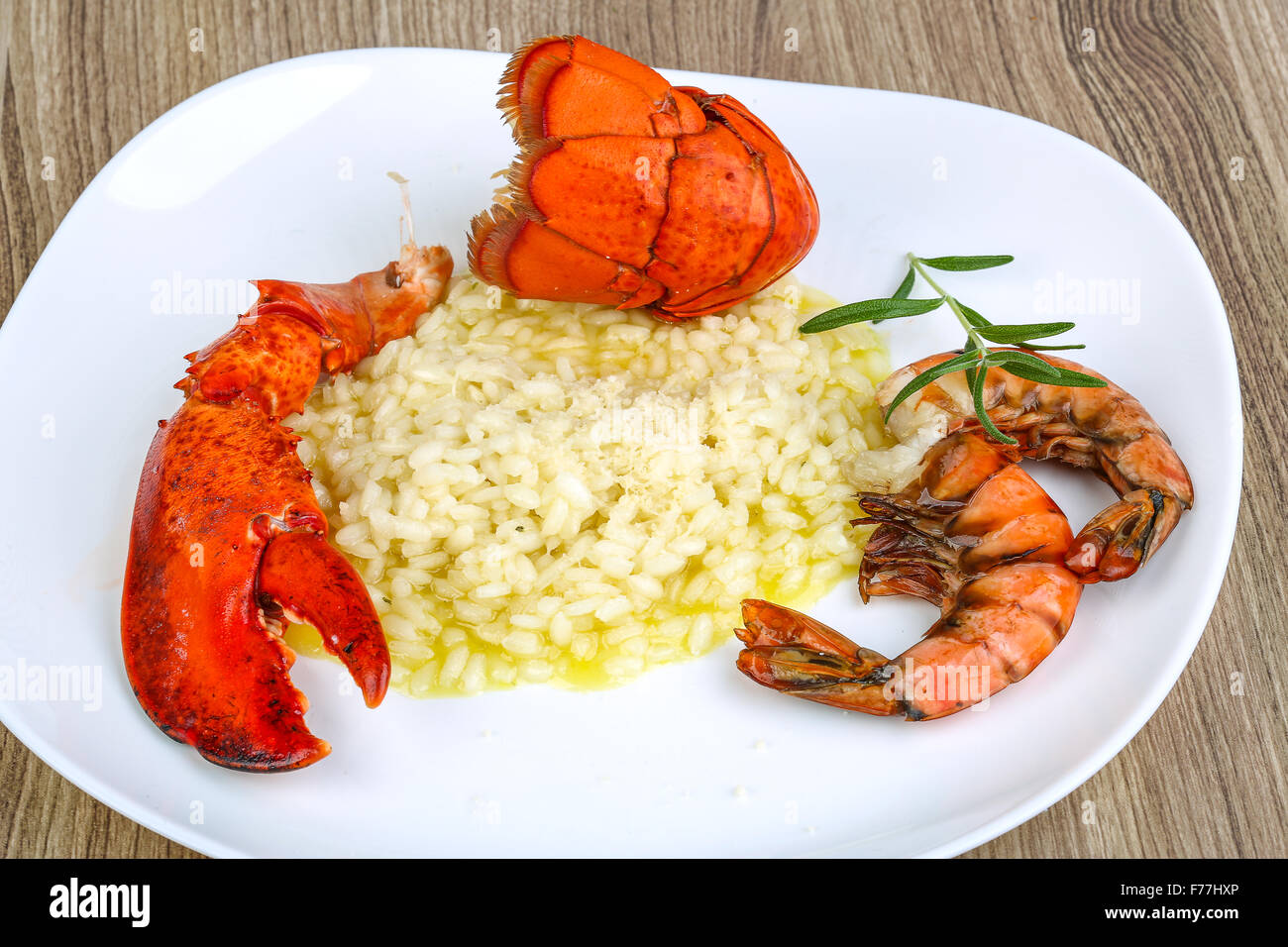 Delicous Risotto with lobster served rosemary and parmesan Stock Photo ...