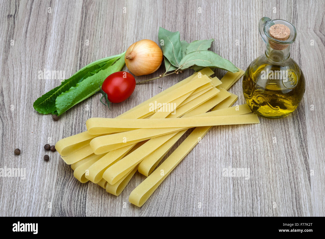 Italian raw Pata Fettuccine on the wood background Stock Photo - Alamy
