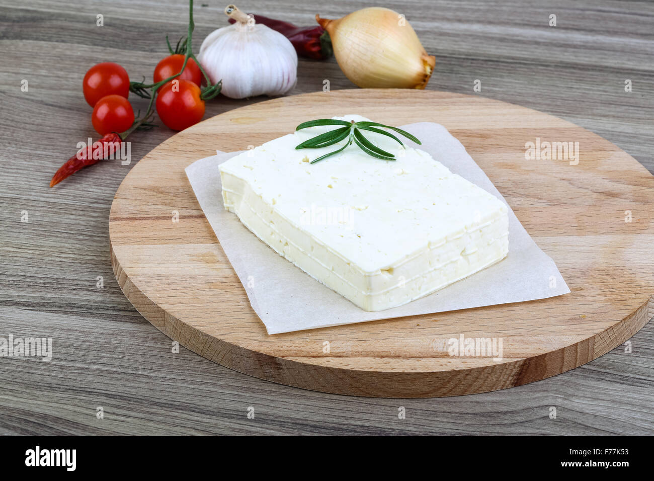 Traditional Caucasian homemade Cheese Brinza with rosemary on wood ...