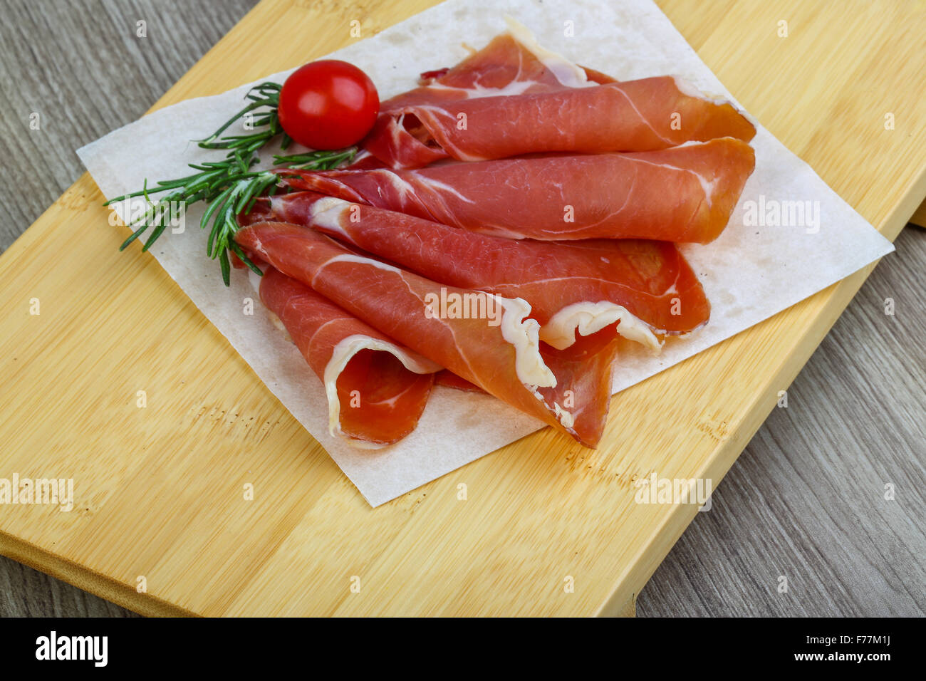 Spanish traditional snack - Jamon with tomato and rosemary Stock Photo ...