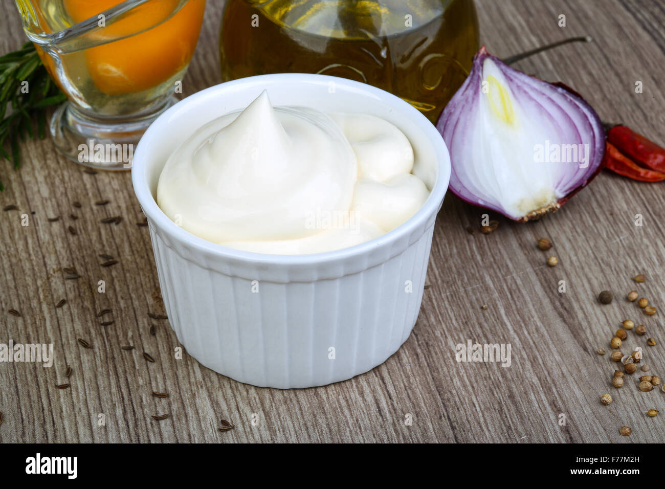 Mayonnaise sauce served raw egg, olive oil and rosemary Stock Photo - Alamy