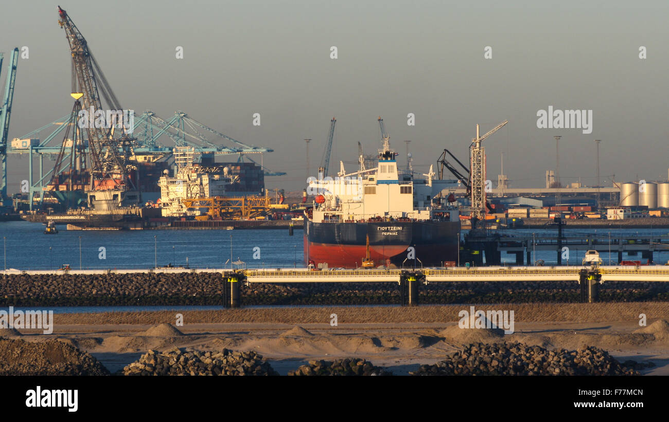 North Sea, on board ship arriving in Rotterdam harbour at sunrise with ...