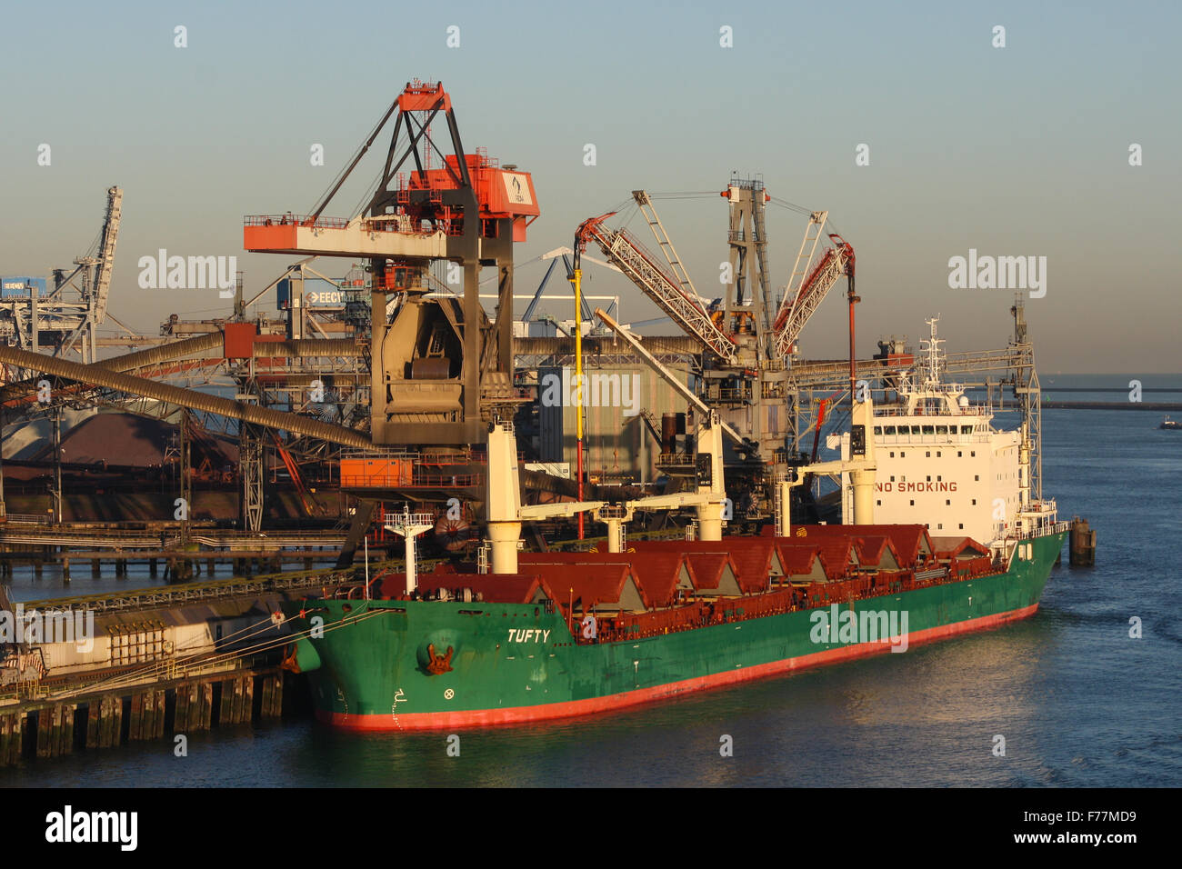 North Sea, Tufty, bulk carrier in Rotterdam harbour at sunrise with ...