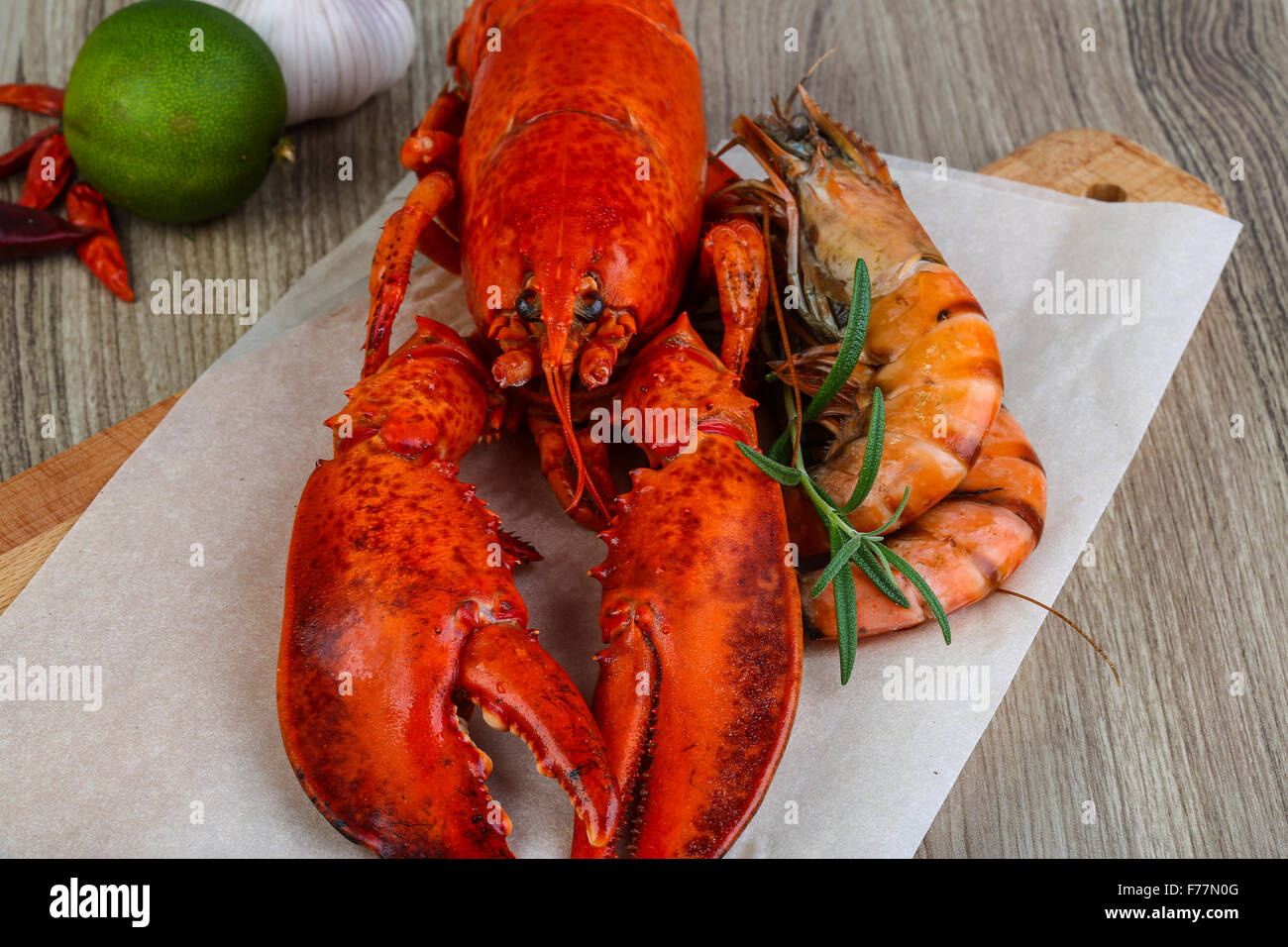 Big cooked lobster and tiger shrimps ready for eating Stock Photo - Alamy
