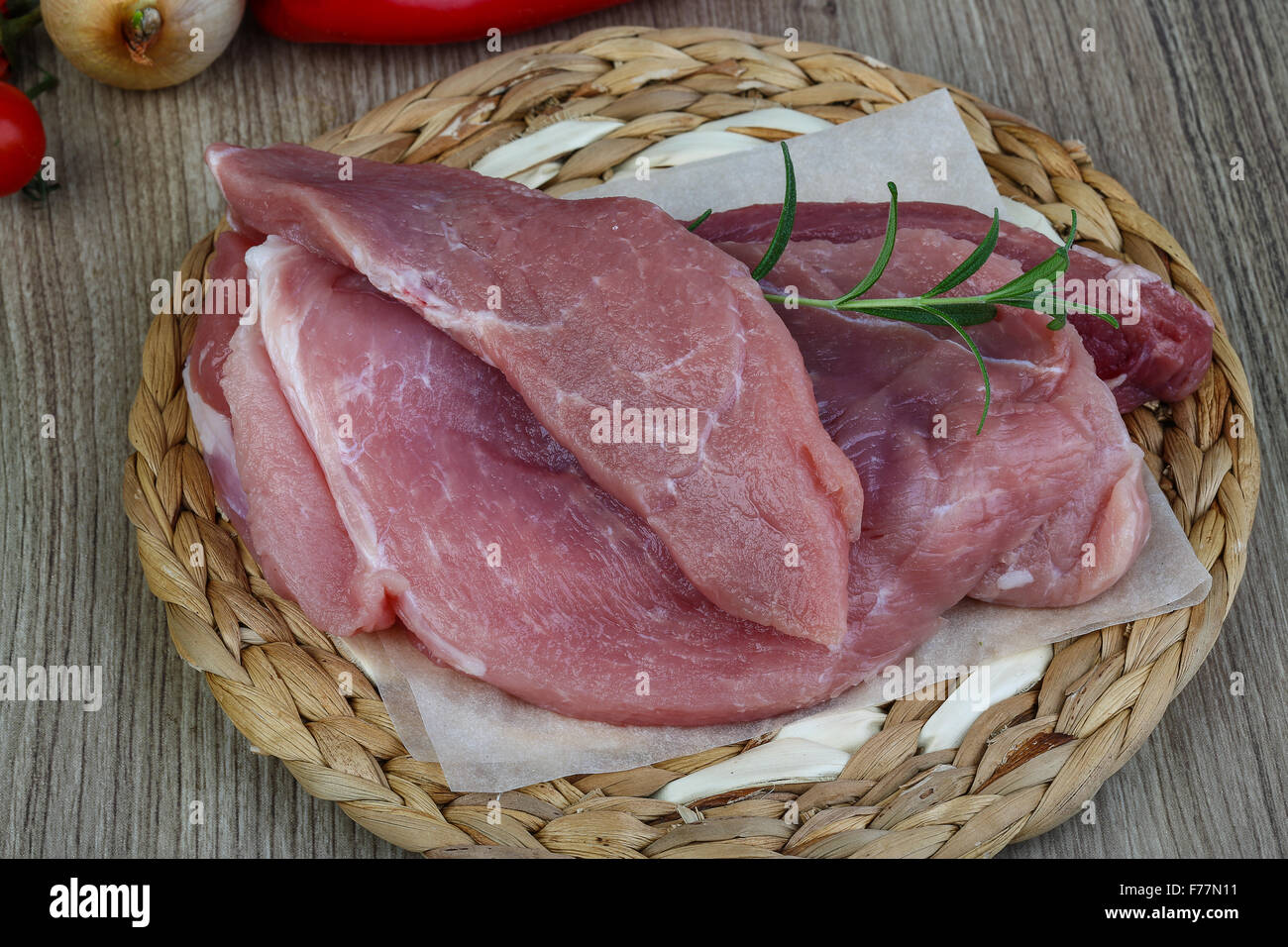 Raw pork Schnitzel with rosemary ready for cooking Stock Photo - Alamy