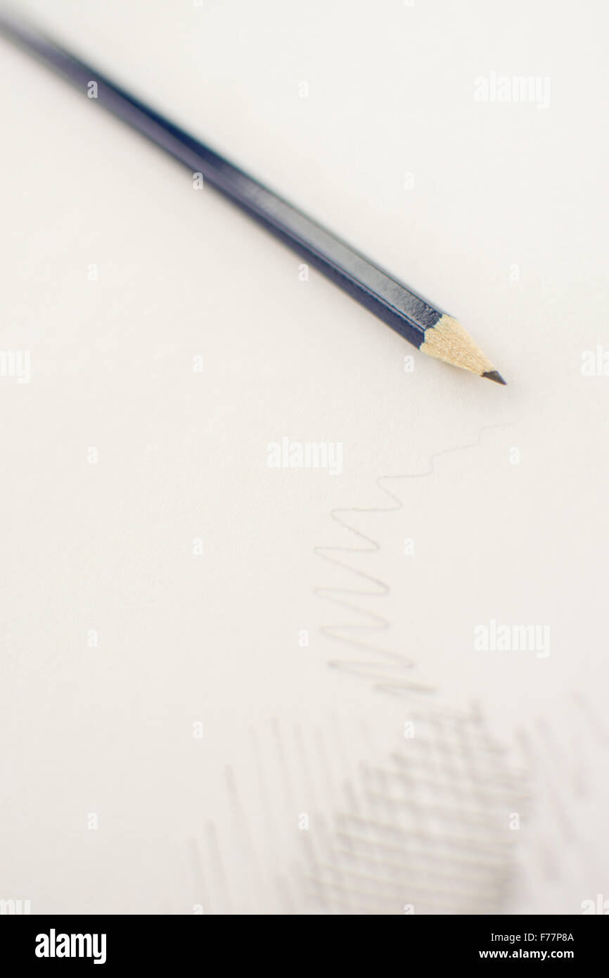 Pencils laid out on white paper ready for creative craft drawing ...