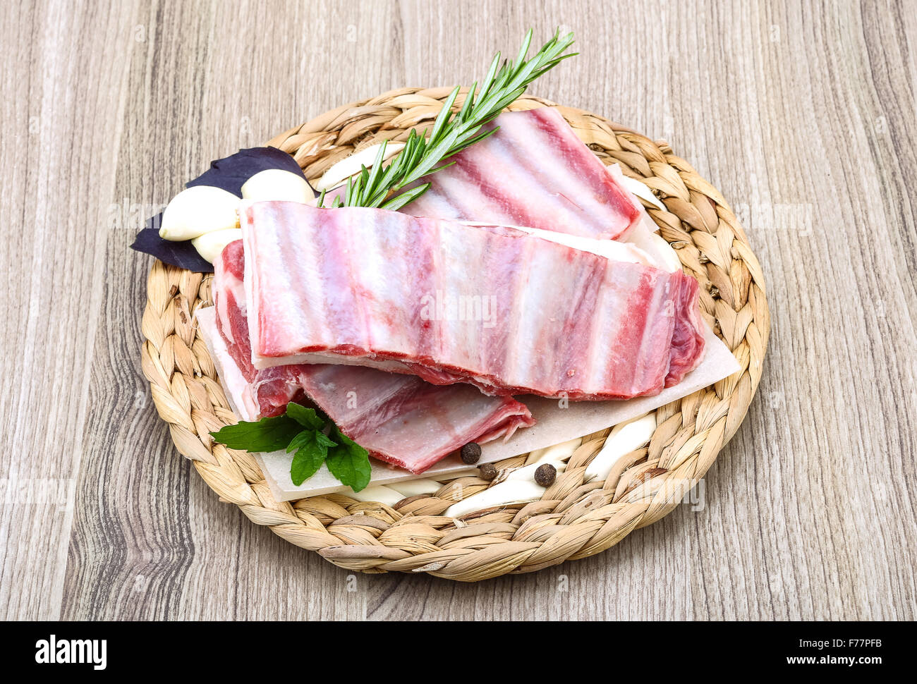 Fresh cold Raw lamb ribs with garlik and pepper - ready for cooking ...