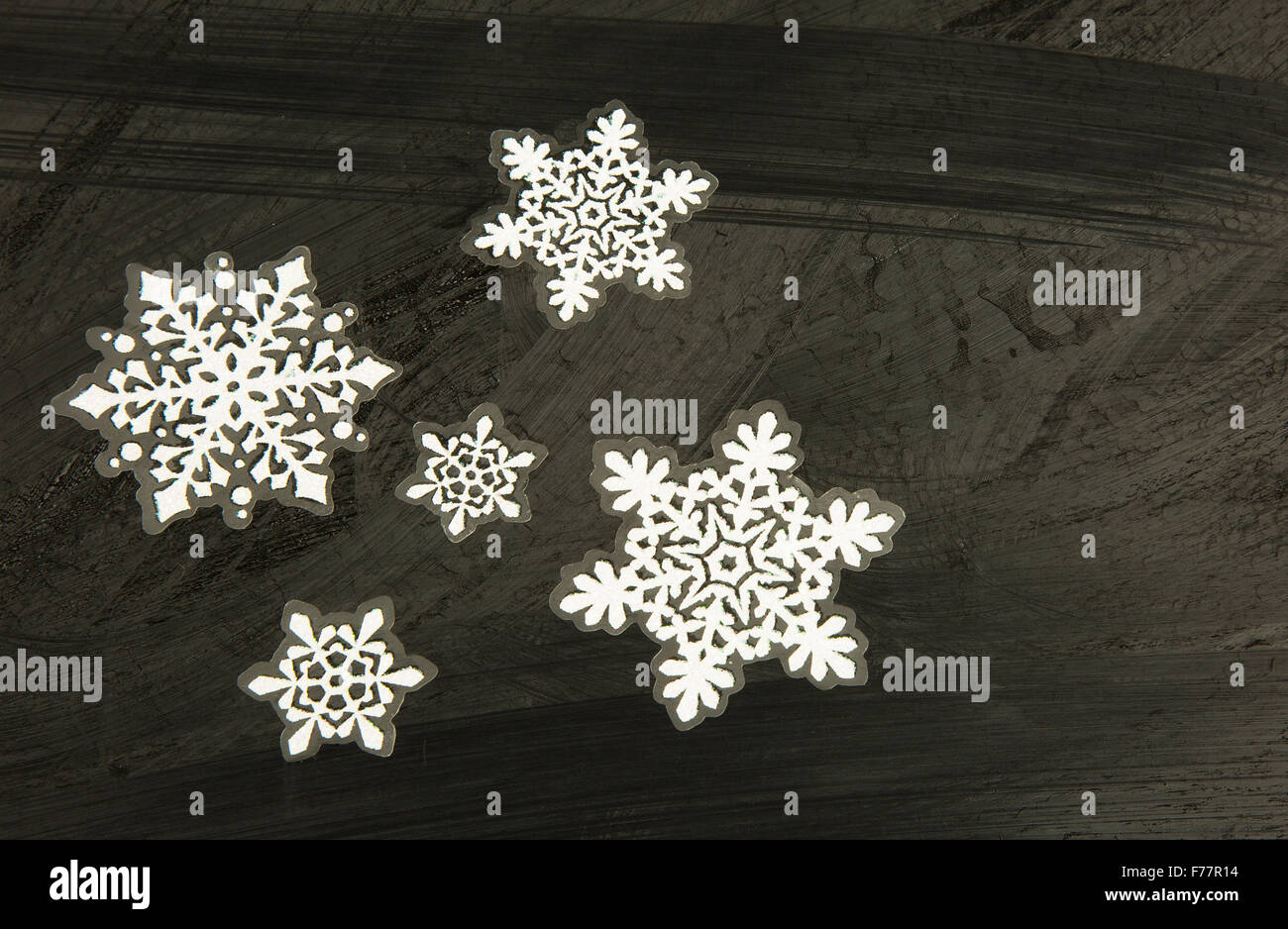 Christmas decoration,stickers four snowflakes on black, frosted surface ...