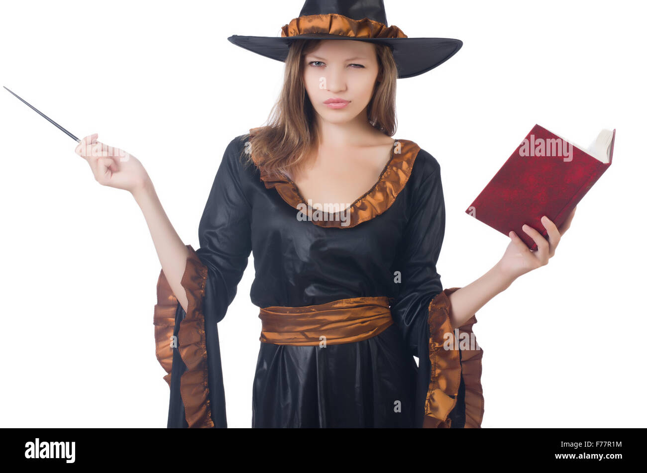 Witch with wand and book isolated on white Stock Photo - Alamy