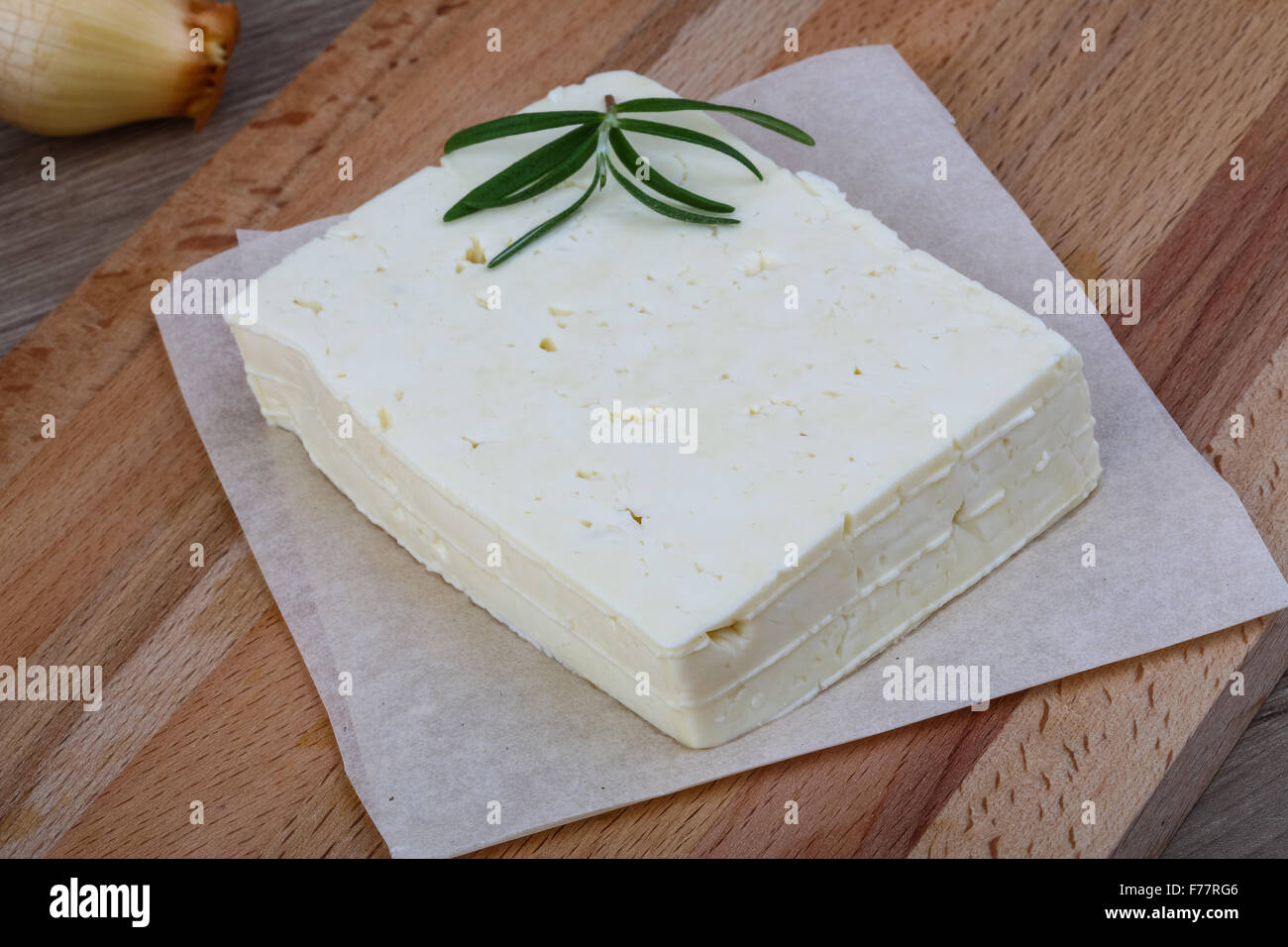 Traditional Caucasian homemade Cheese Brinza with rosemary on wood ...