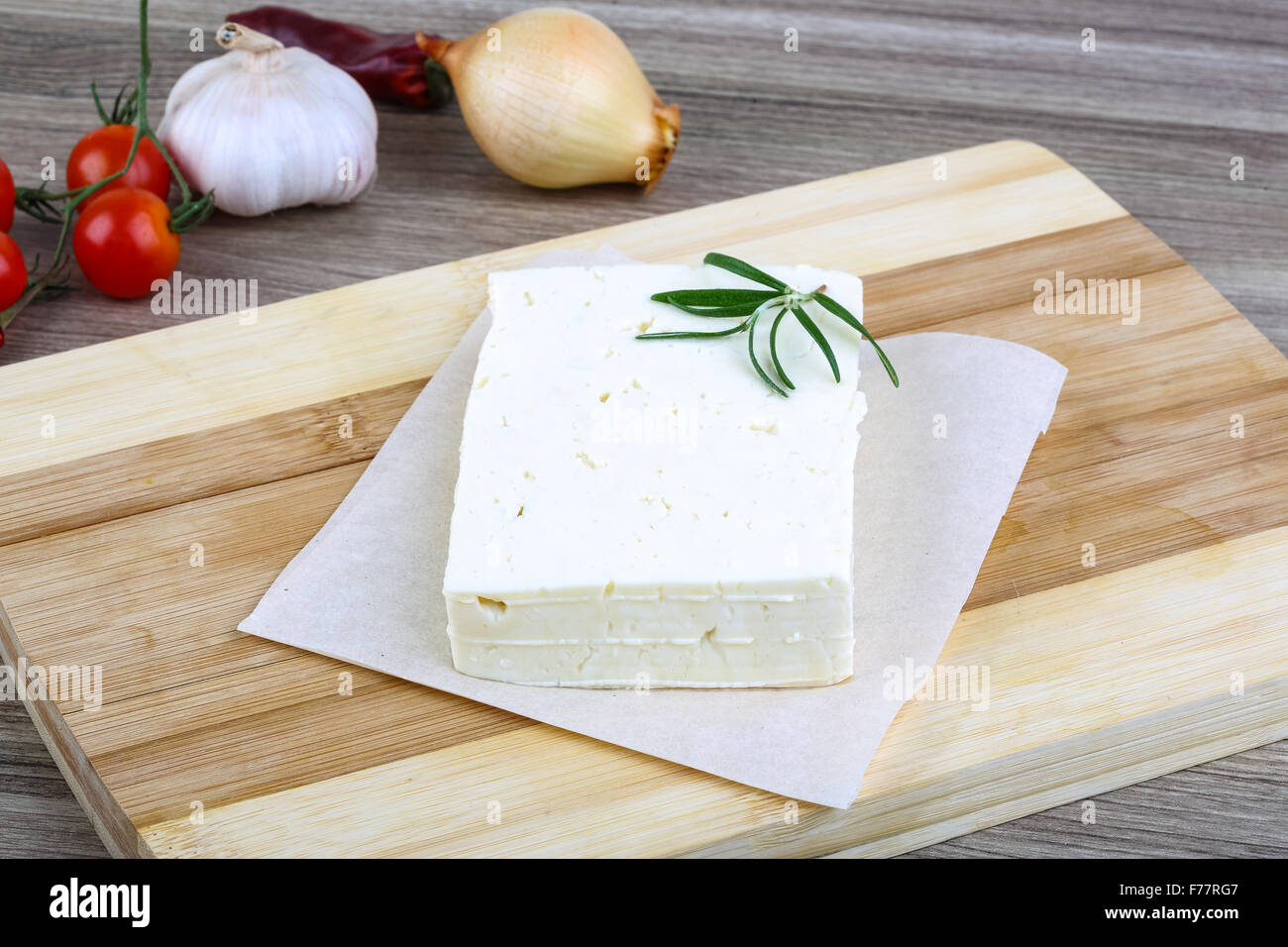 Traditional Caucasian homemade Cheese Brinza with rosemary on wood ...
