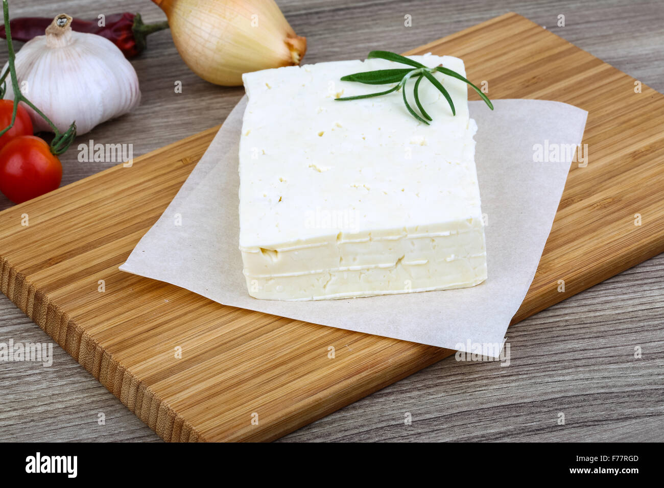 Traditional Caucasian homemade Cheese Brinza with rosemary on wood ...