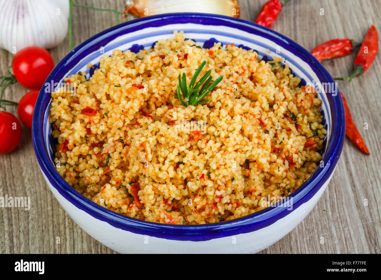 Arabic traditional cuisine - Couscous with tomato and green onion Stock ...