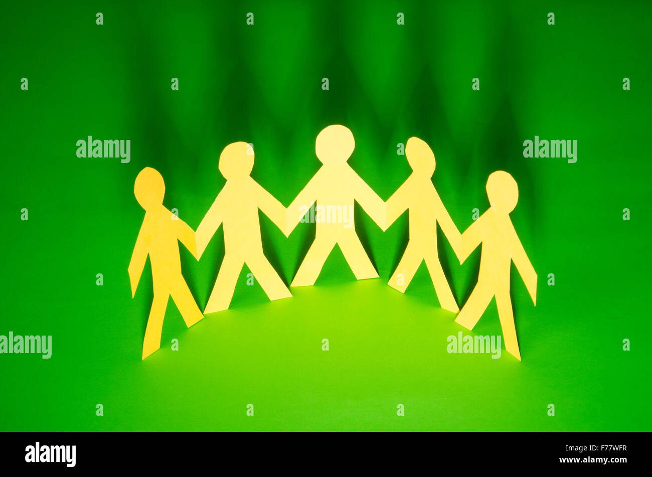 Paper people in teamworking concept Stock Photo - Alamy