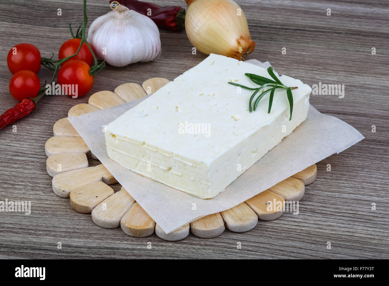 Traditional Caucasian homemade Cheese Brinza with rosemary on wood ...