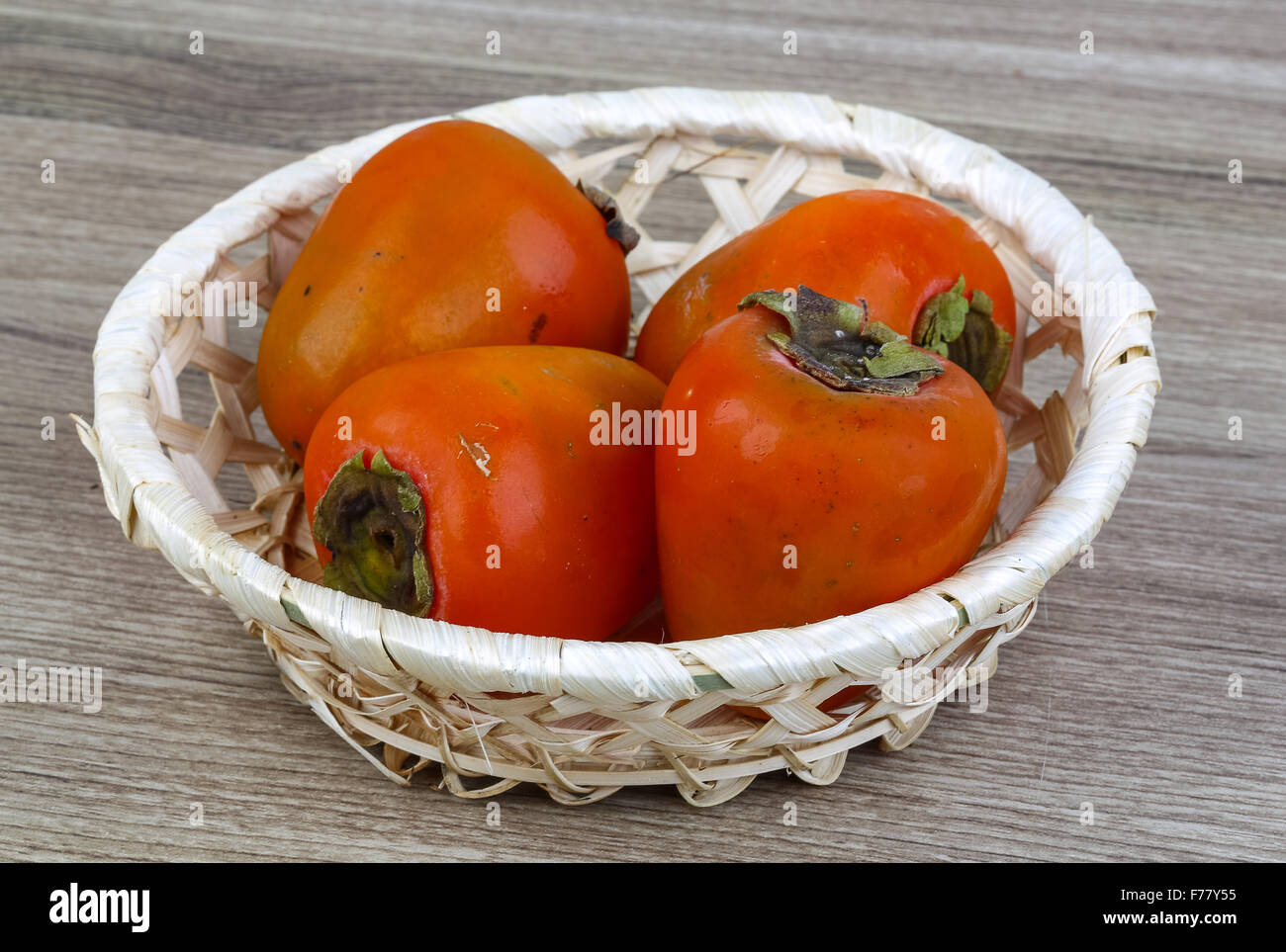 Fresh ripe juicy Persimmon fruit on the wood background Stock Photo - Alamy