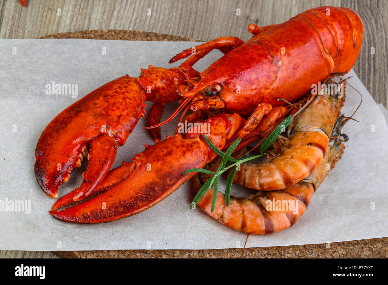 Big cooked lobster and tiger shrimps ready for eating Stock Photo - Alamy