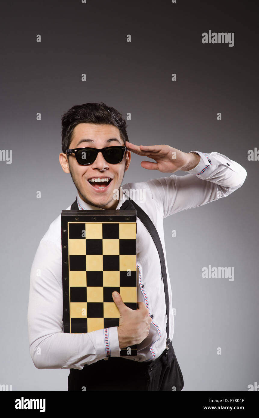 Funny chess player with board Stock Photo - Alamy