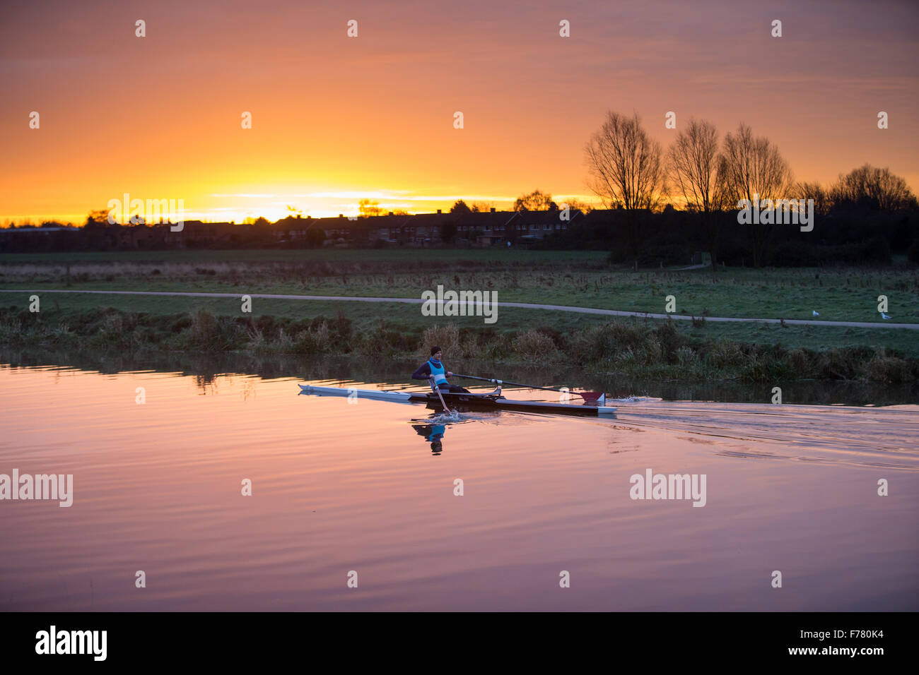Cambridge rowers on the River Cam in Cambridge at sunrise in the autumn ...