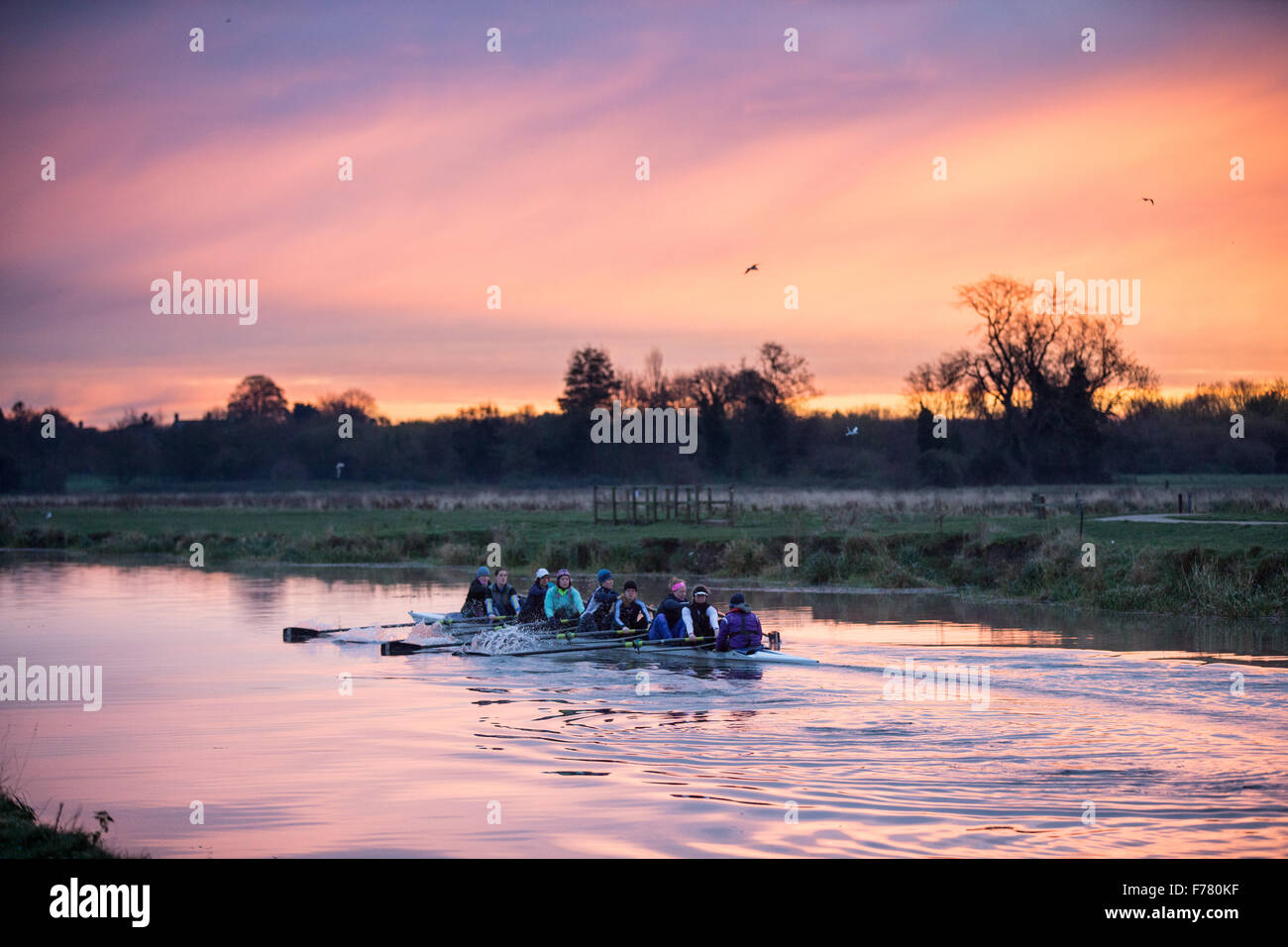 Cambridge rowers on the River Cam in Cambridge at sunrise in the autumn ...