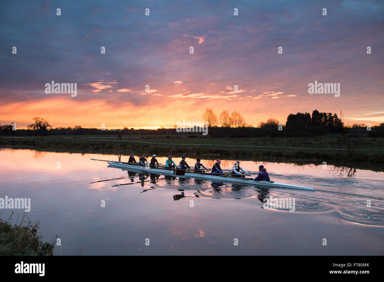 Cambridge rowers on the River Cam in Cambridge at sunrise in the autumn ...