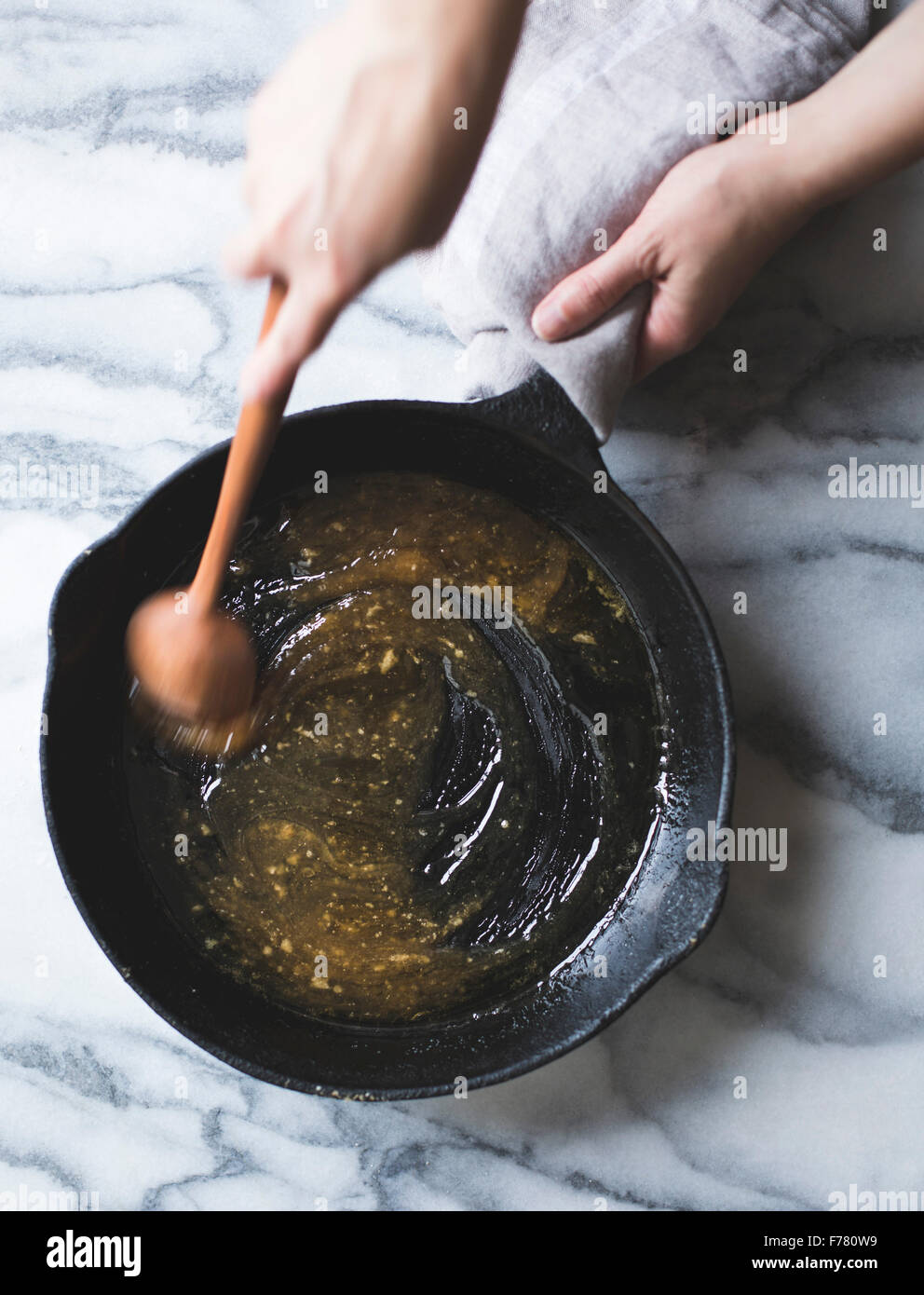 Mixing sauce in a pan Stock Photo - Alamy