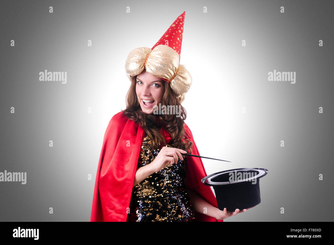 Female magician isolated on white Stock Photo - Alamy